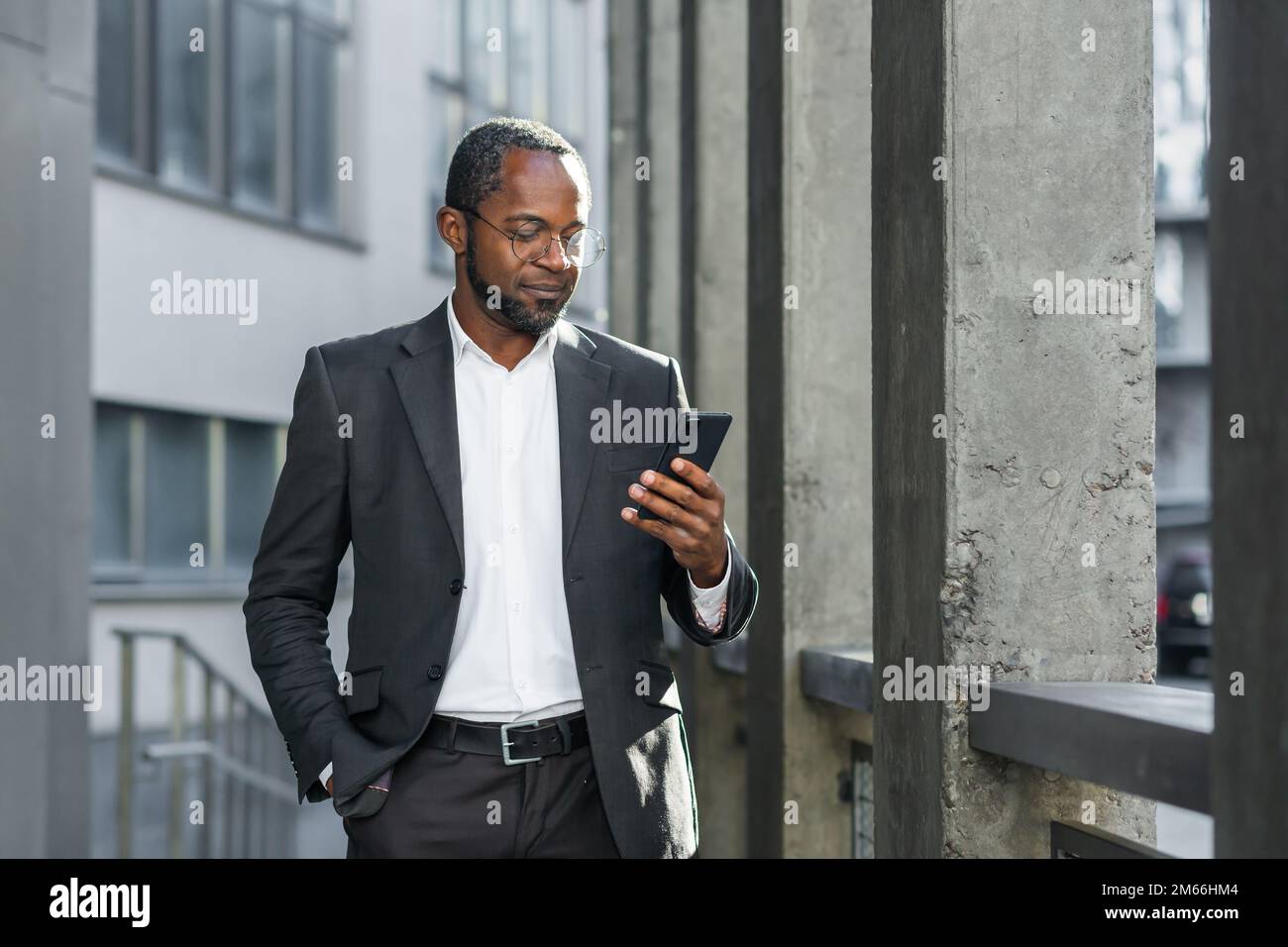 Serious and successful African American boss businessman outside office ...