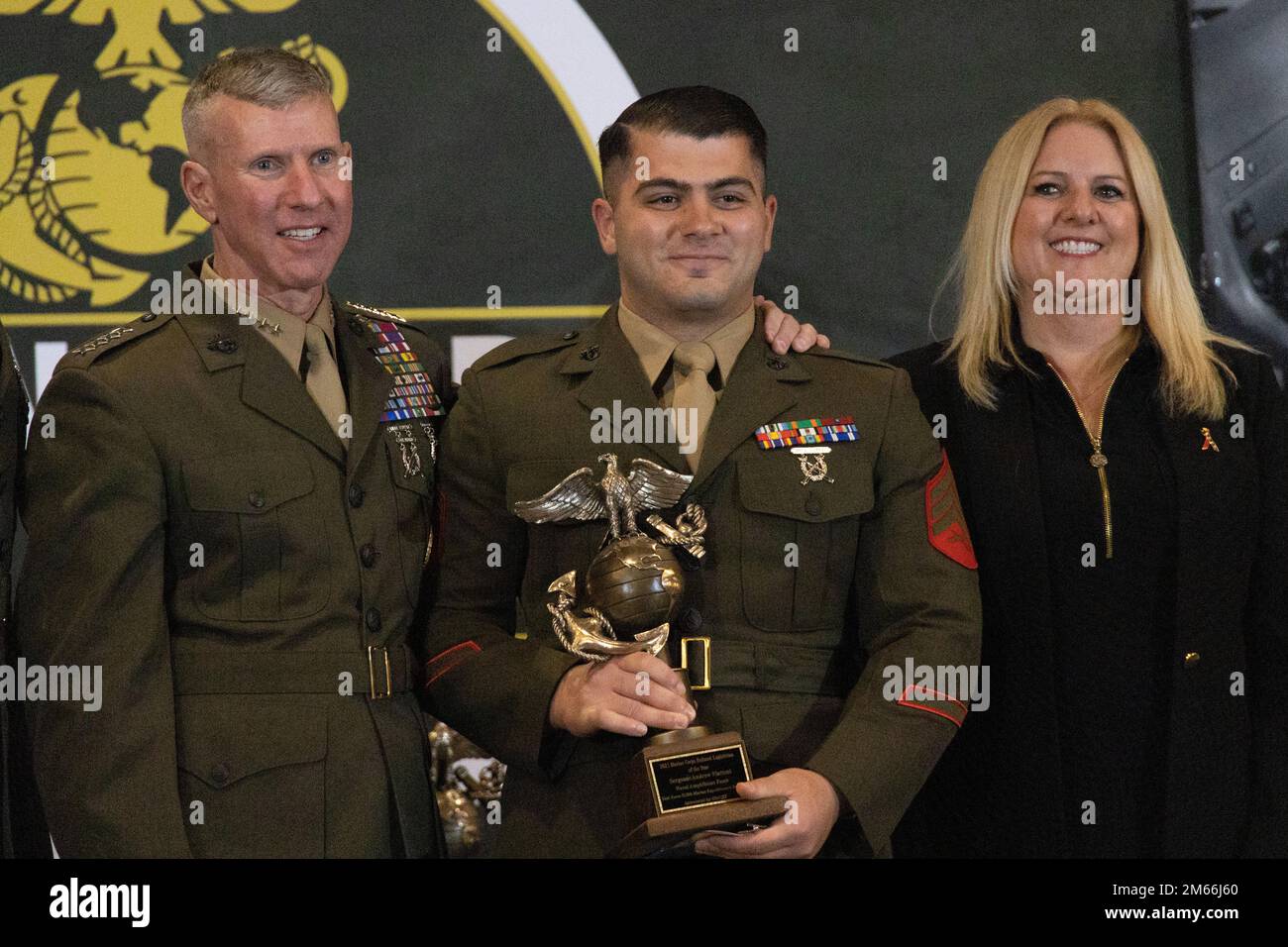 United States Marine Corps Sgt. Andrew Piattoni is presented his award ...