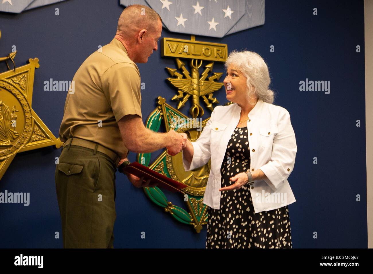 Ms. Lisa Bishop is presented her award for being the Installations ...