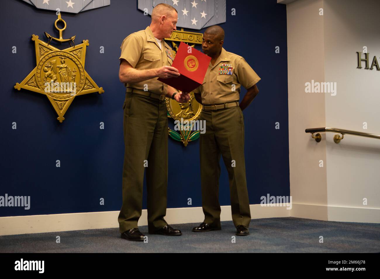 United States Marine Corps Maj. Orlando Higgins, accepts an award at ...