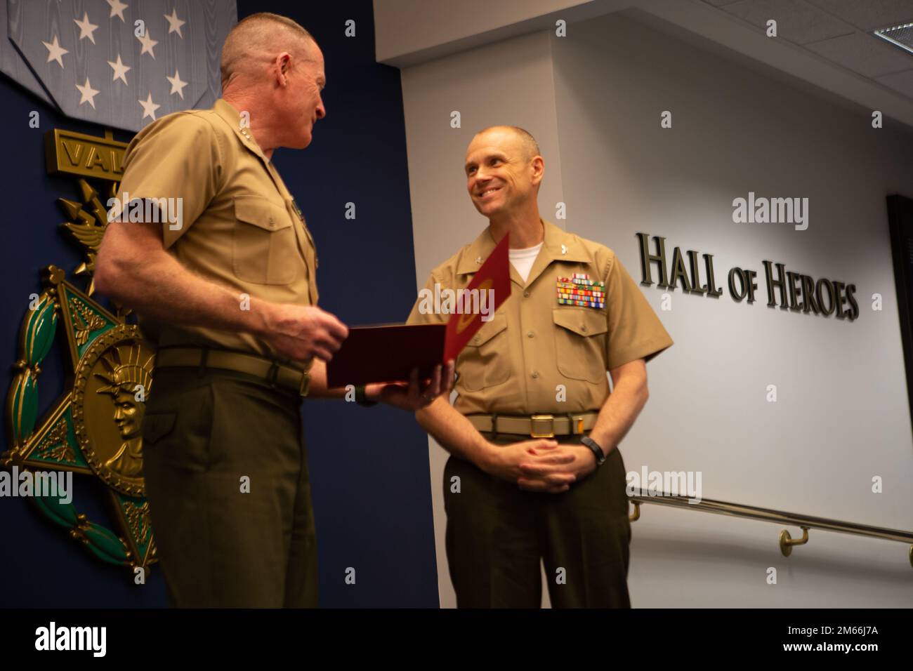 United States Marine Corps Col. Douglas Burke, accepts an award at the ...