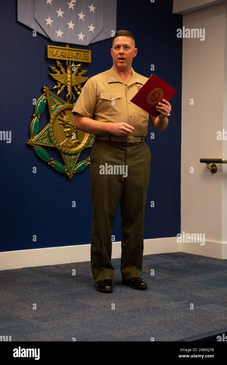 United States Marine Corps Lt. Col. James Garza accepts an award at the ...