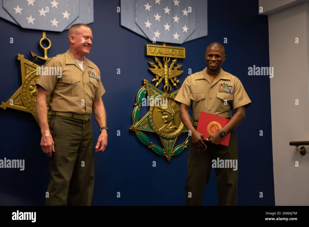United States Marine Corps Maj. Orlando Higgins, accepts an award at ...