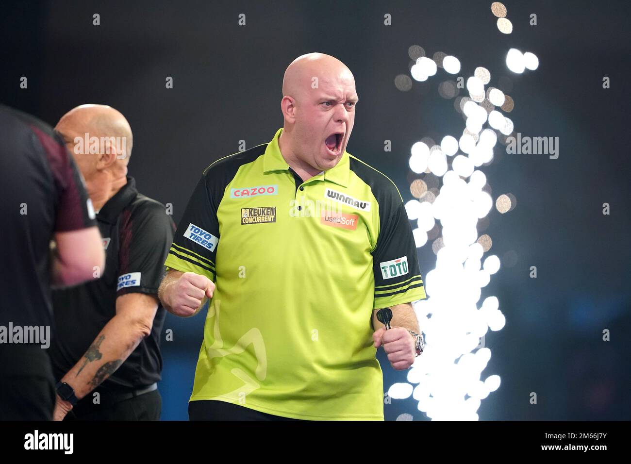 Michael van Gerwen celebrates victory over Dimitri Van den Bergh during ...