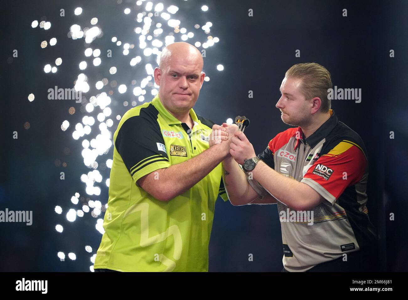 Michael van Gerwen celebrates victory over Dimitri Van den Bergh during ...