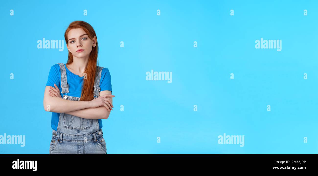 Serious-looking professional bossy redhead female skilfull girl, cross ...