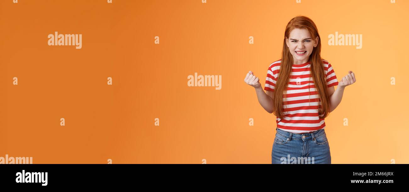 Annoyed pissed redhead female lose competition, clench fists angry ...