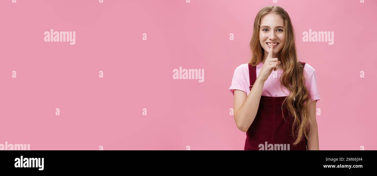 Girl wanna share her beauty secret smiling tricky and friendly showing ...
