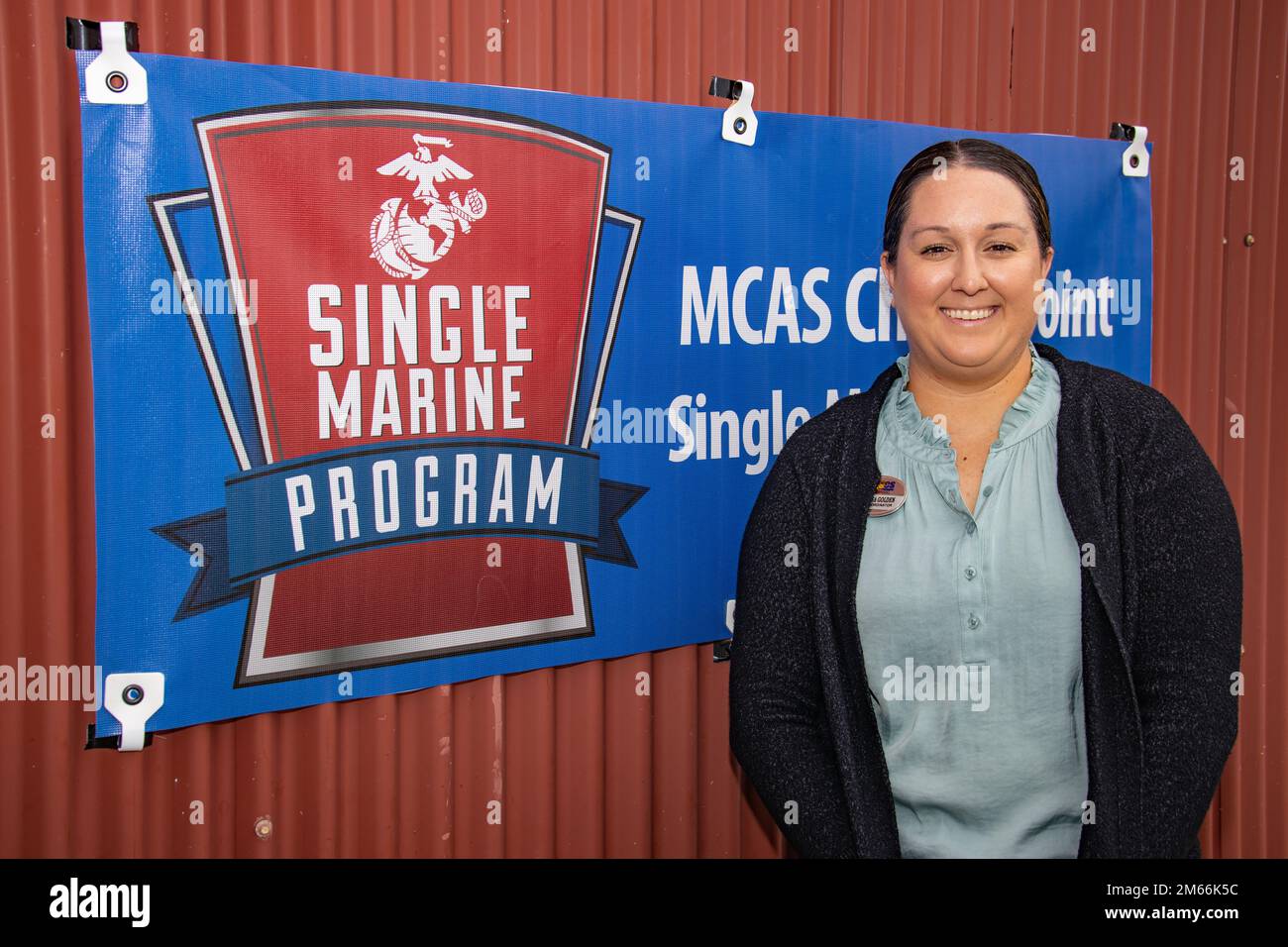 Vanessa Golden stands outside her office alongside the Single Marine Program banner at Marine ...