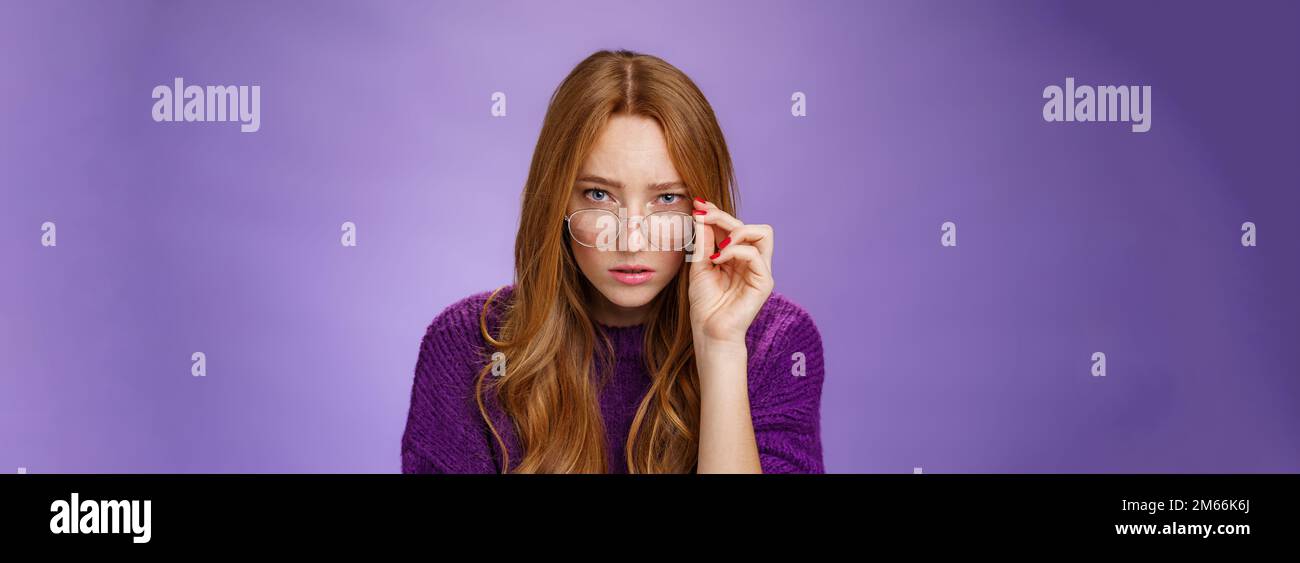 Questioned and unsure cute smart female detective with ginger hair ...