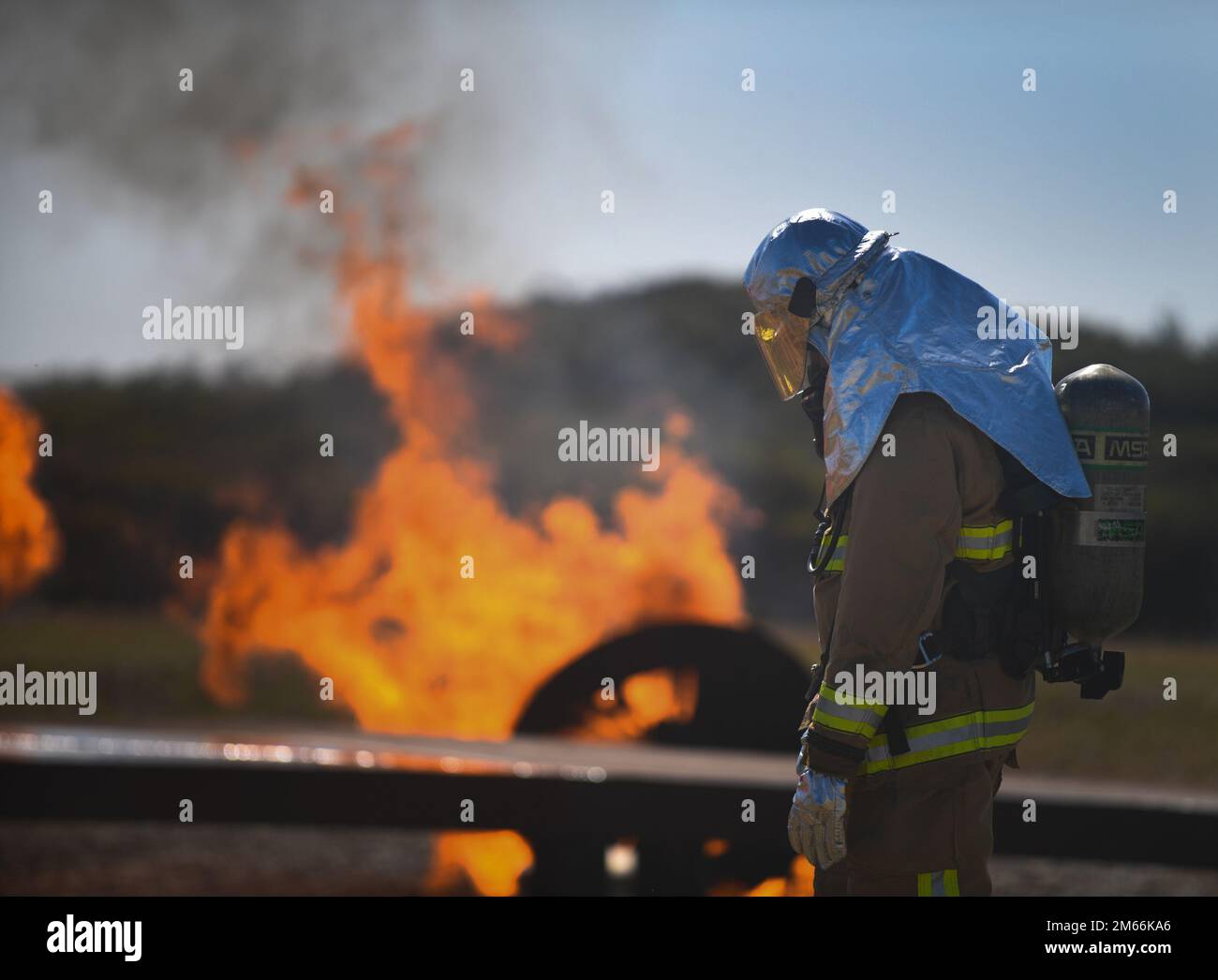 Airman Anthony Joey Crow, 30th CES firefighter, looks on as other teams ...