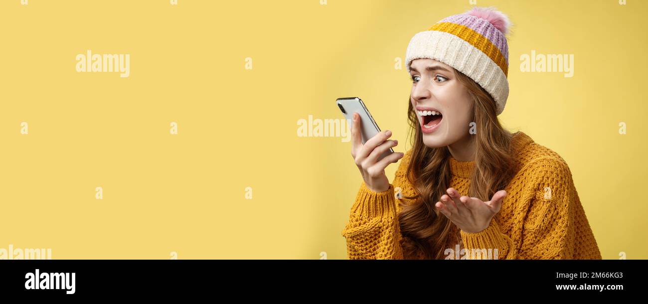 Annoyed pissed freak-out crazy woman shouting smartphone look display ...