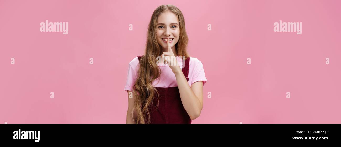 Girl wanna share her beauty secret smiling tricky and friendly showing ...