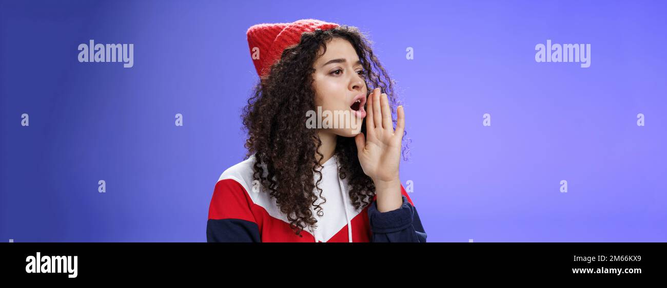 Portrait of worried sister calling sibling outdoors open mouth looking ...