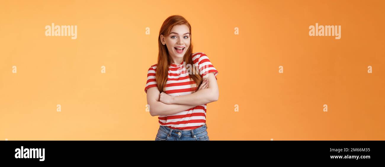 Excited cheerful ginger girl long natural red hair open mouth ...