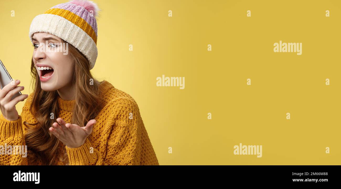 Annoyed pissed freak-out crazy woman shouting smartphone look display ...