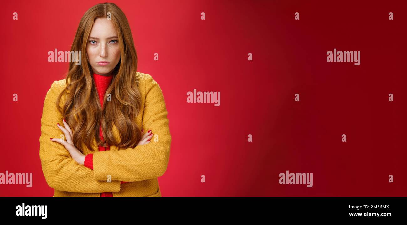 Offended and angry redhead girlfriend expressing dismay and hate as ...