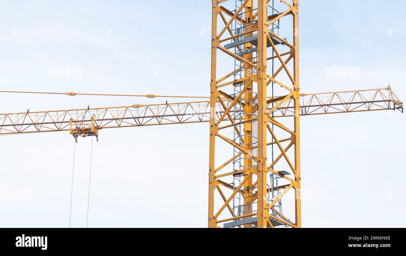 Construction crane at work on a busy building site Stock Photo - Alamy