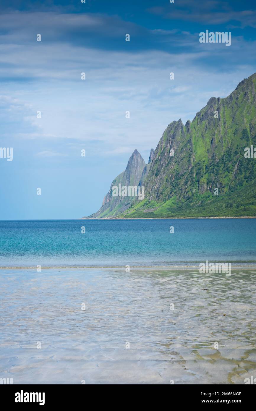 The crystal clear water of the Ersfjordstranda beach in Senja Island ...