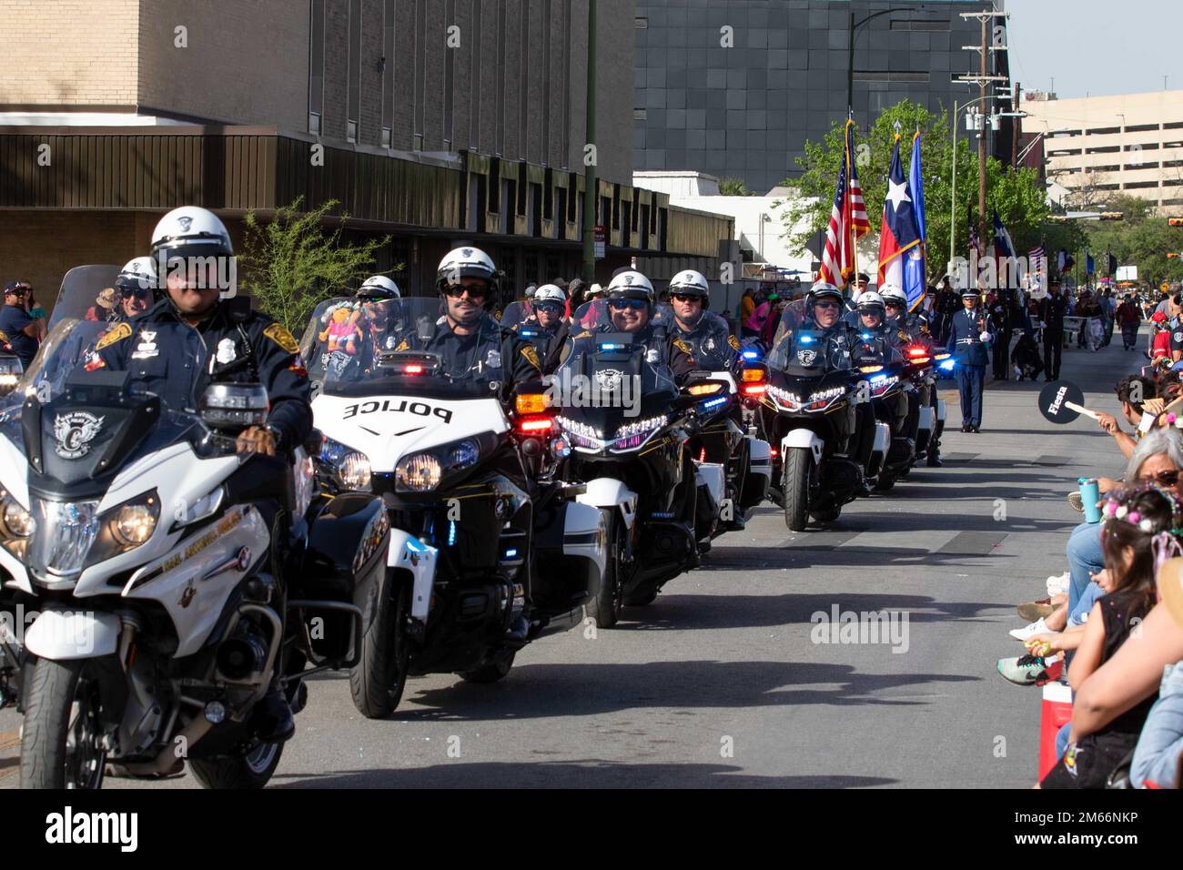 Police officers with the San Antonio Police Motor Unit ride motorcycles ...