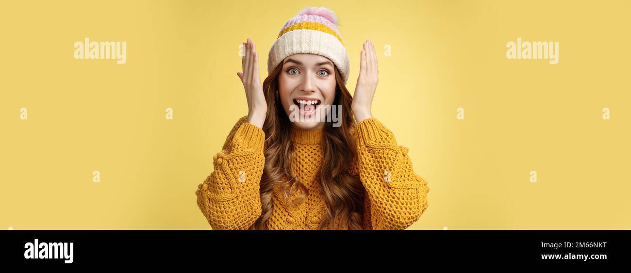 Close-up amused surprised pretty young european woman open eyes smiling ...