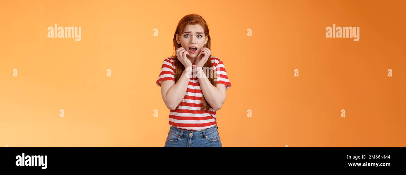 Innocent scared redhead female victim feel afraid standing stupor ...