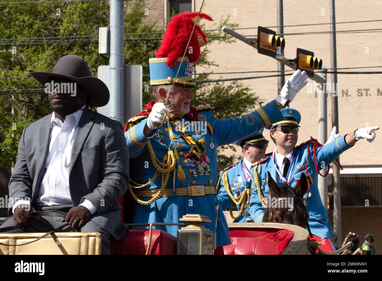 Barton Simpson, King Antonio of the Texas Cavaliers, waves to attendees ...