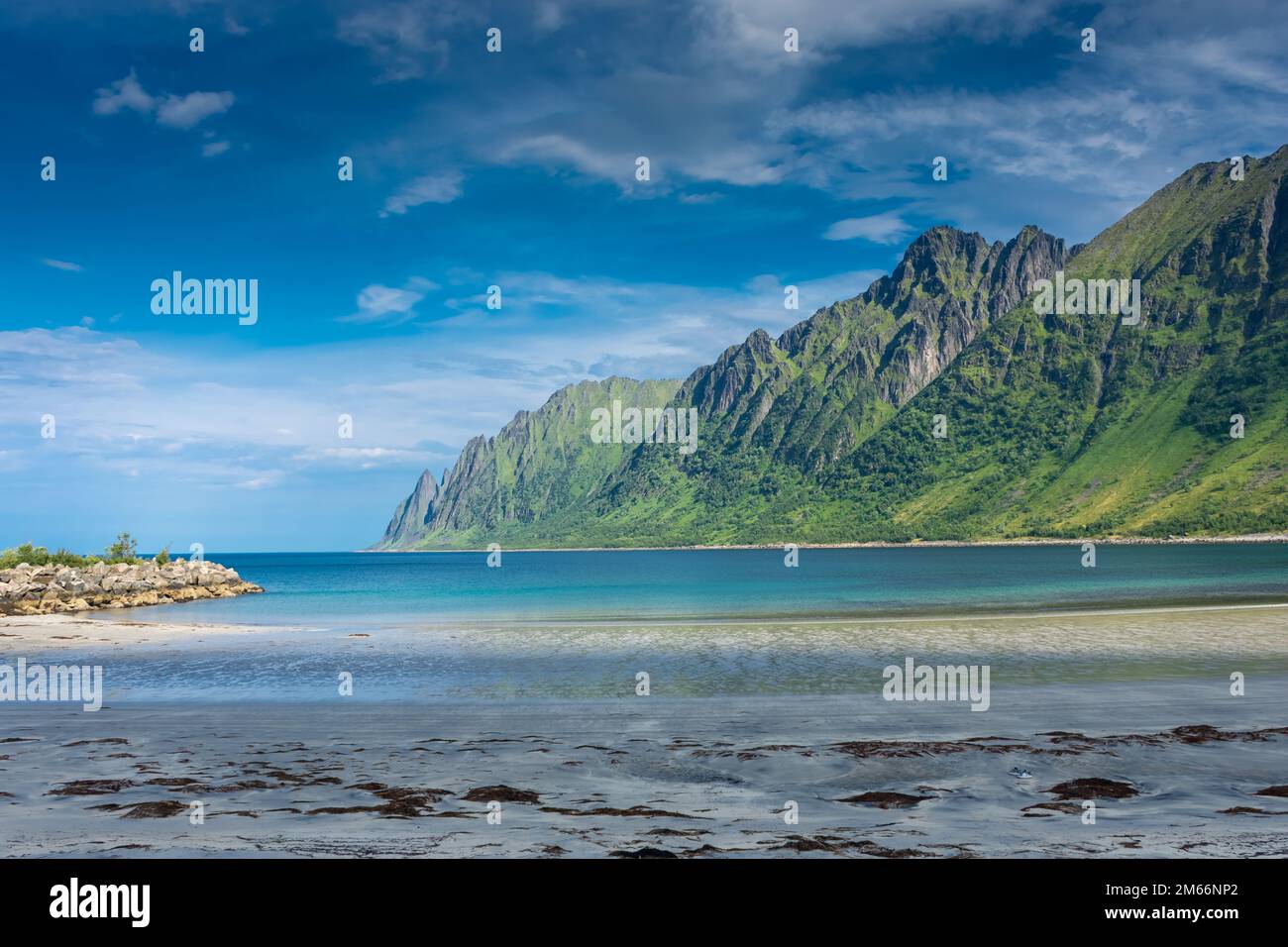 The crystal clear water of the Ersfjordstranda beach in Senja Island ...