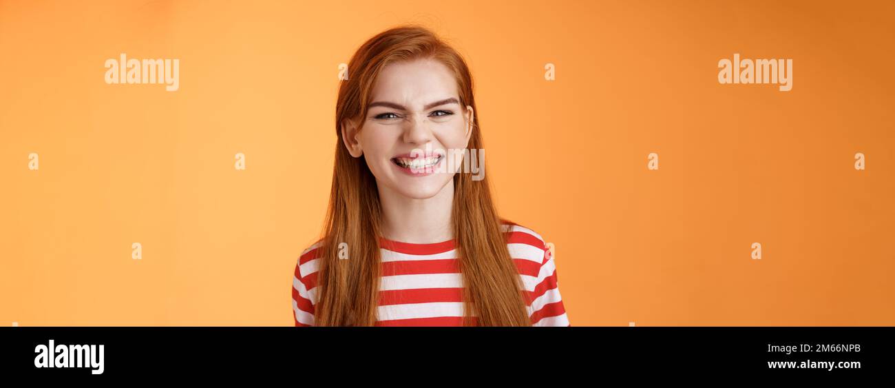 Close-up sassy good-looking cheerful redhead sly girl smiling toothy ...