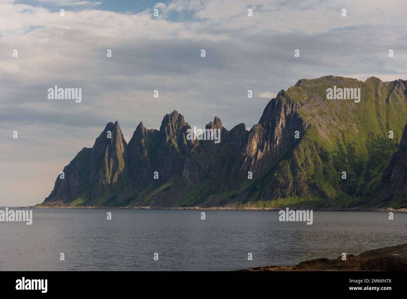 The Tungeneset (Devil's Teeth), mountains over the ocean in Senja ...