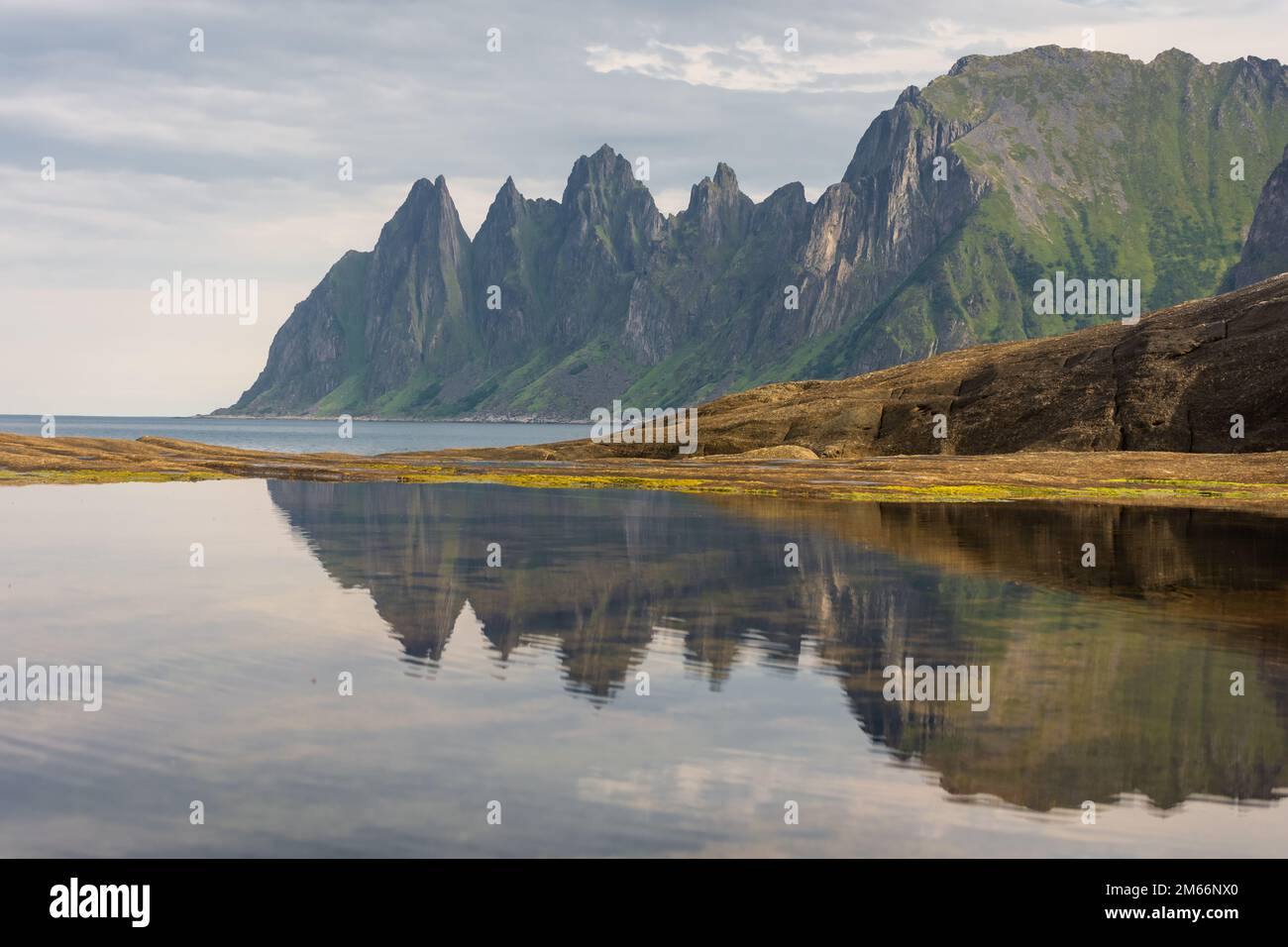 The Tungeneset (Devil's Teeth), mountains over the ocean in Senja ...