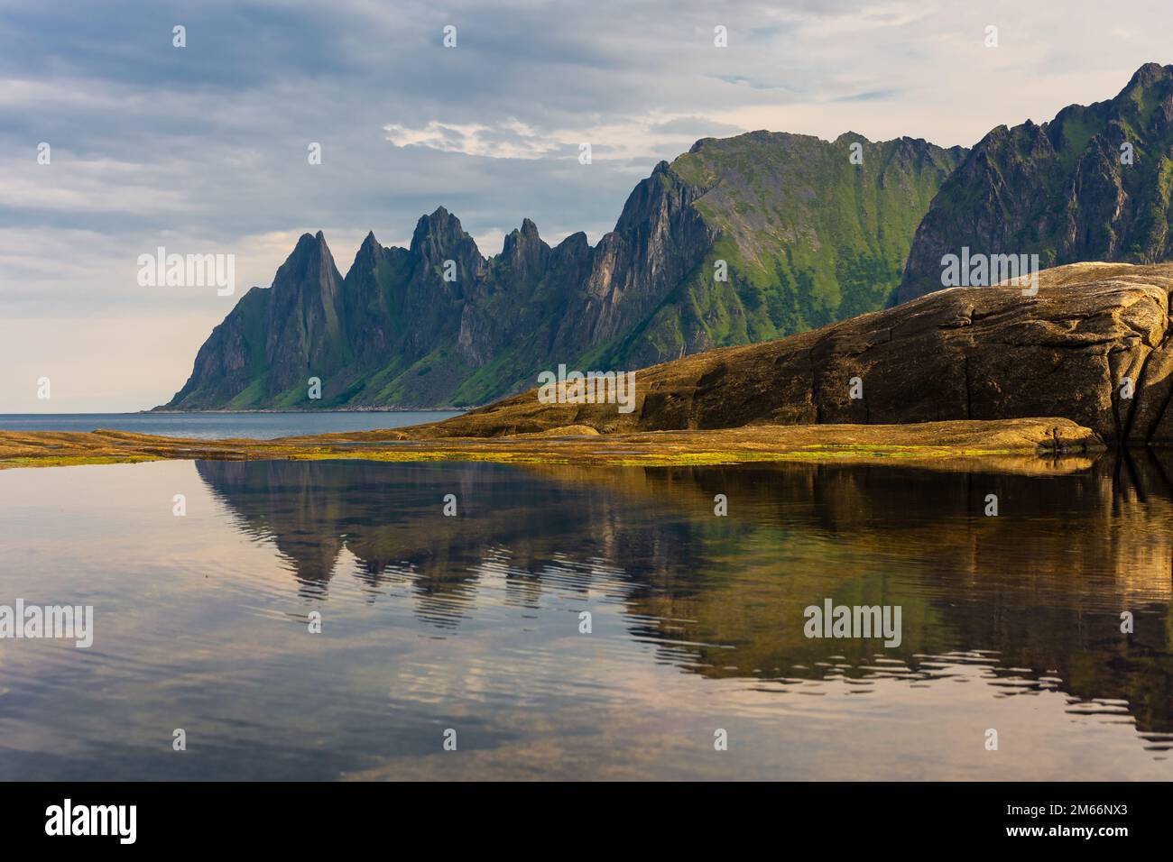 The Tungeneset (Devil's Teeth), mountains over the ocean in Senja ...