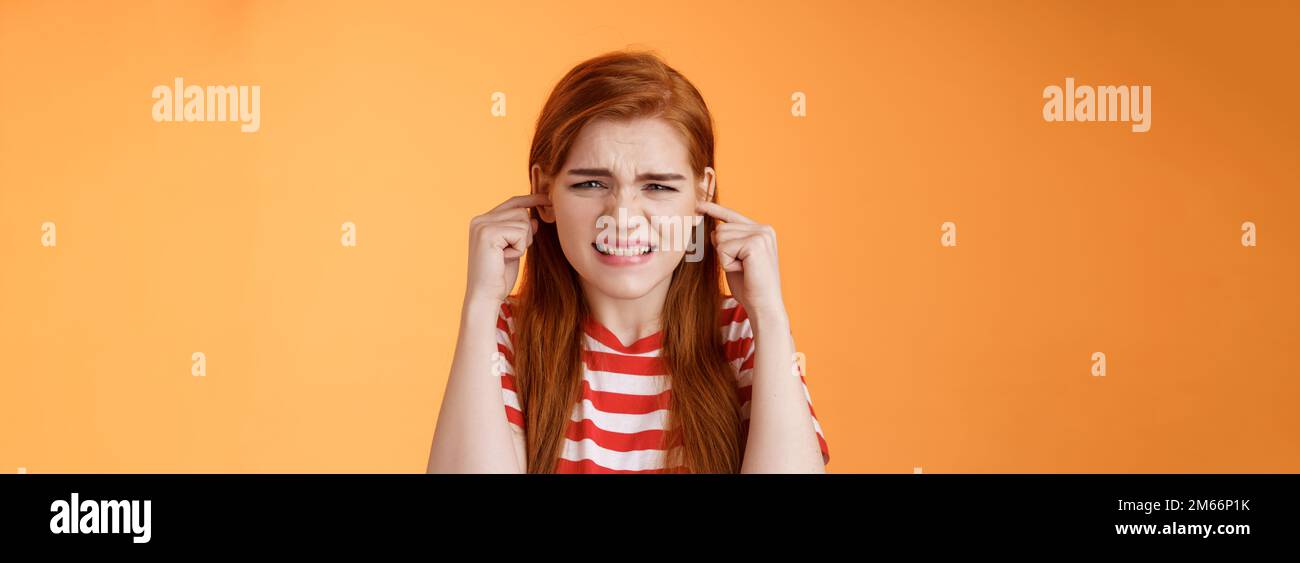 Turn off sound. Annoyed disturbed redhead female cannot study hear ...