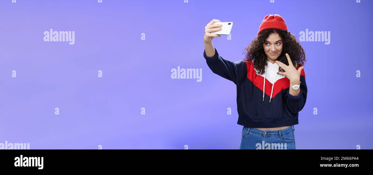 Cool and stylish good-looking caucasian female with curly hair in ...