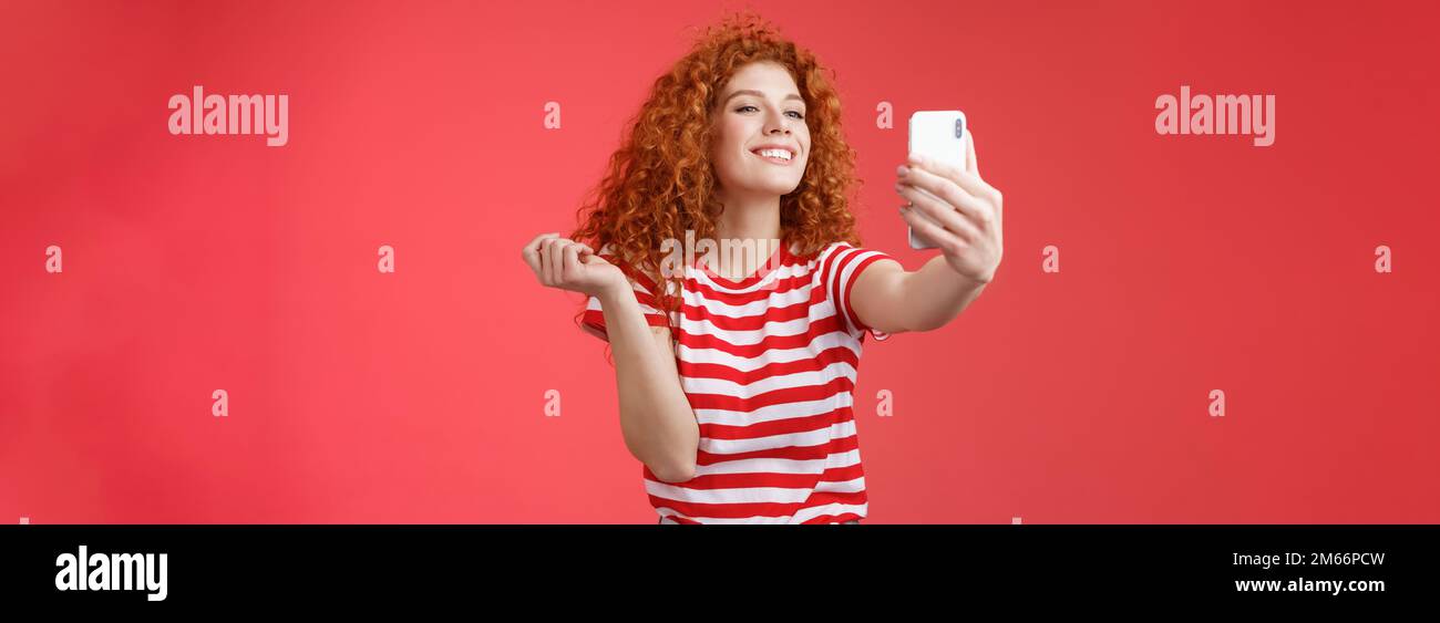 Cute pleased happy good-looking redhead ginger girl curly hairstyle ...