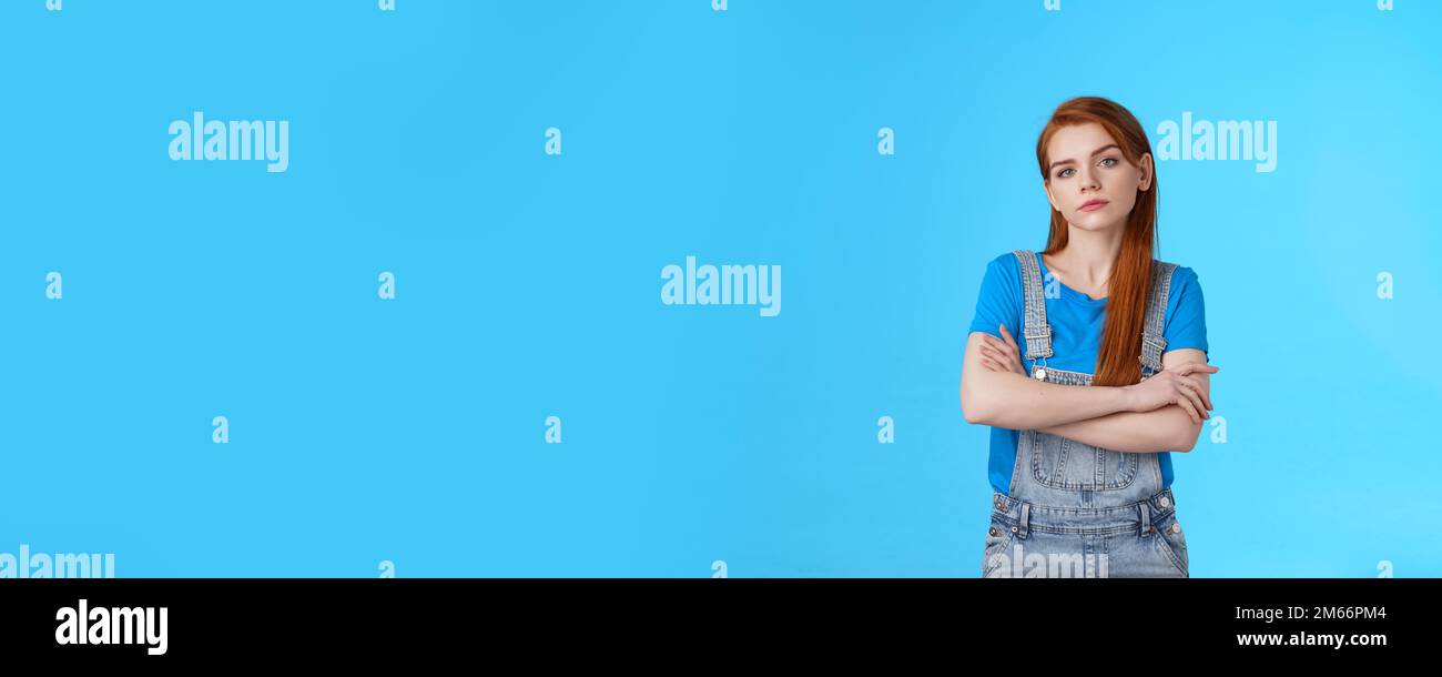 Serious-looking professional bossy redhead female skilfull girl, cross ...