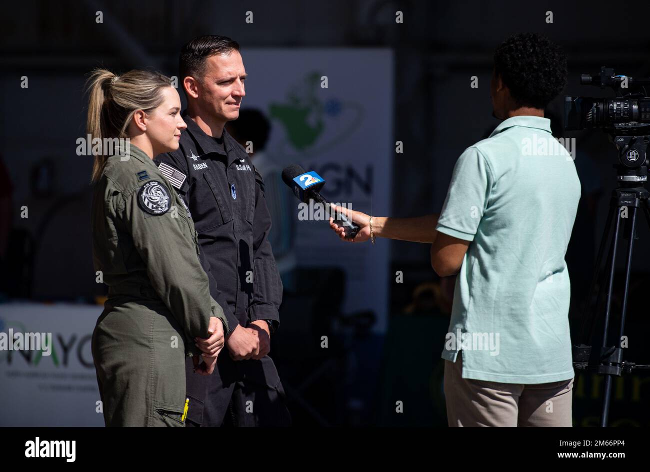 A local news reporter interviews members of the F-16 Viper ...