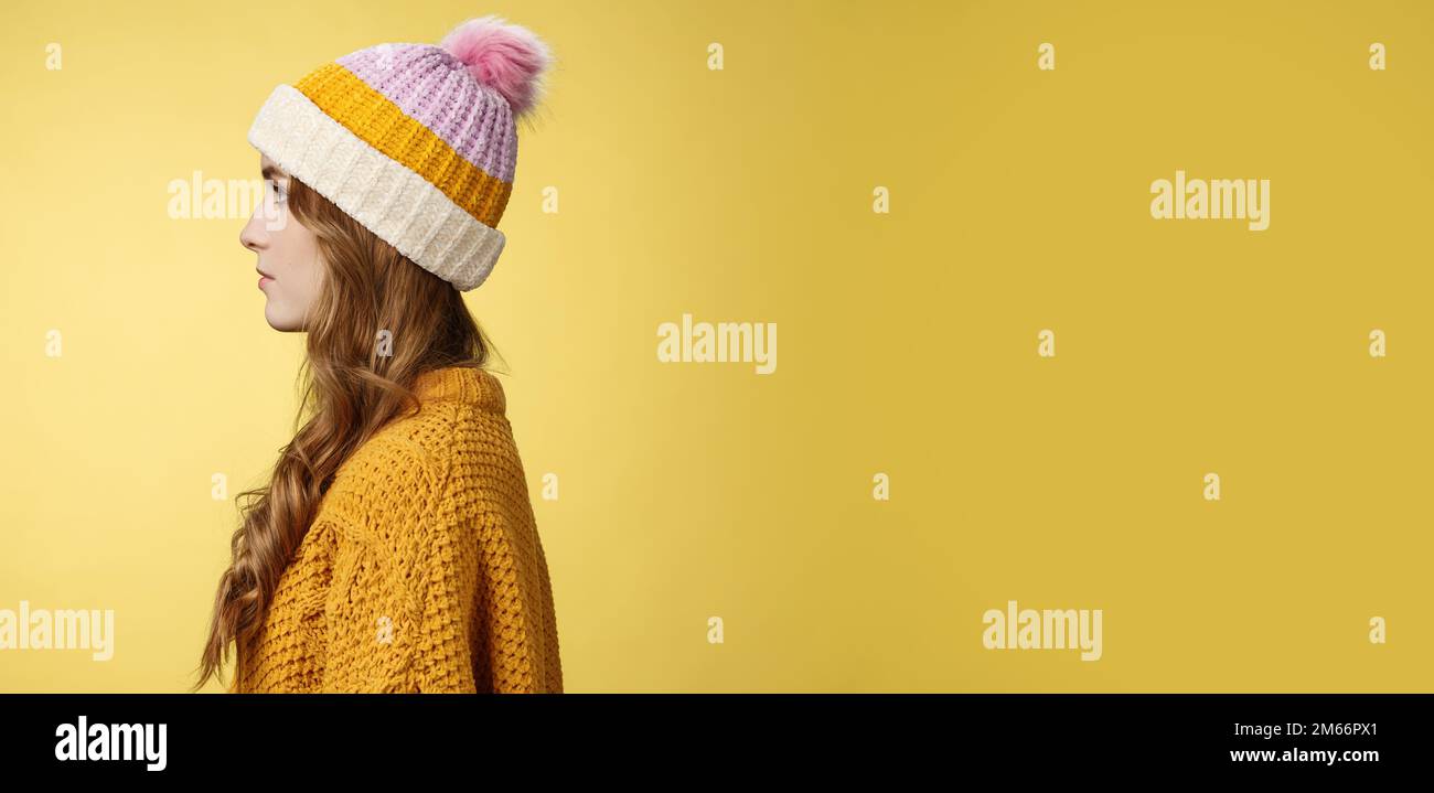 Profile shot attractive female curly hairstyle wearing hat knitted ...