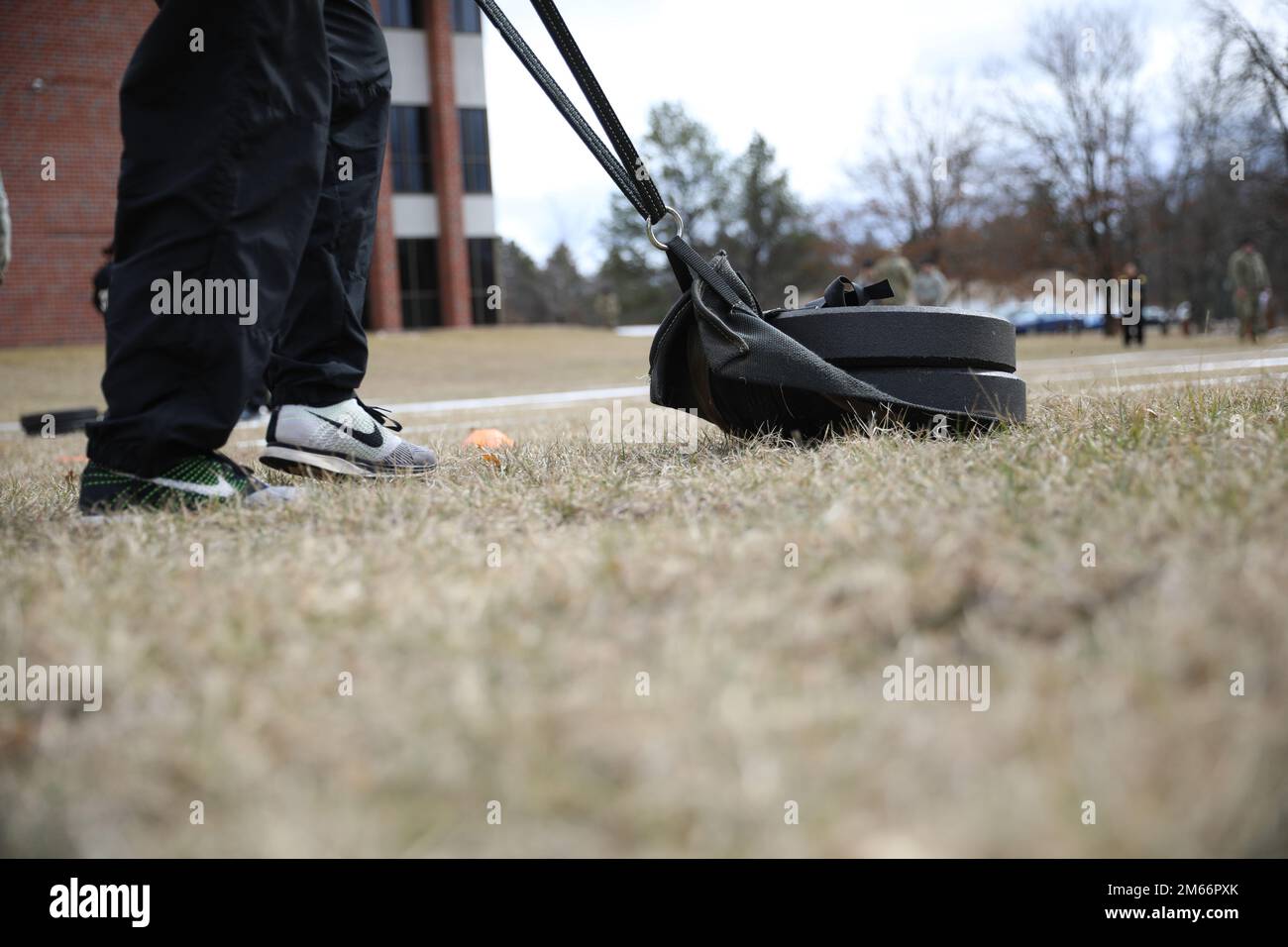 A Soldier pulls a 90 lb. sled for the sprint-drag-carry portion of the ...
