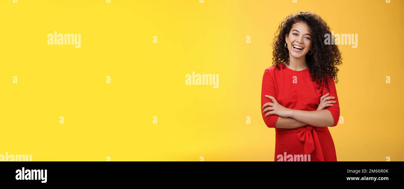 Self-assured happy enthusiastic curly-haired female reporter in cute ...