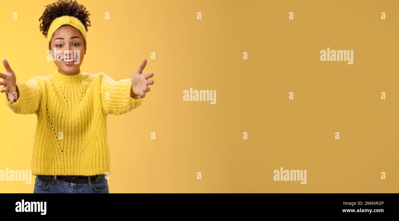 Come closer let me hug you. Touched lovely glad african-american young ...