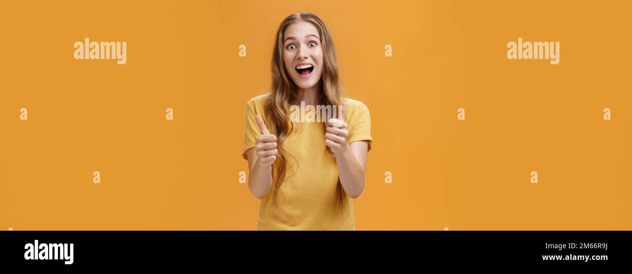 Excited girl expressed support and cheer raising thumbs up in approval ...