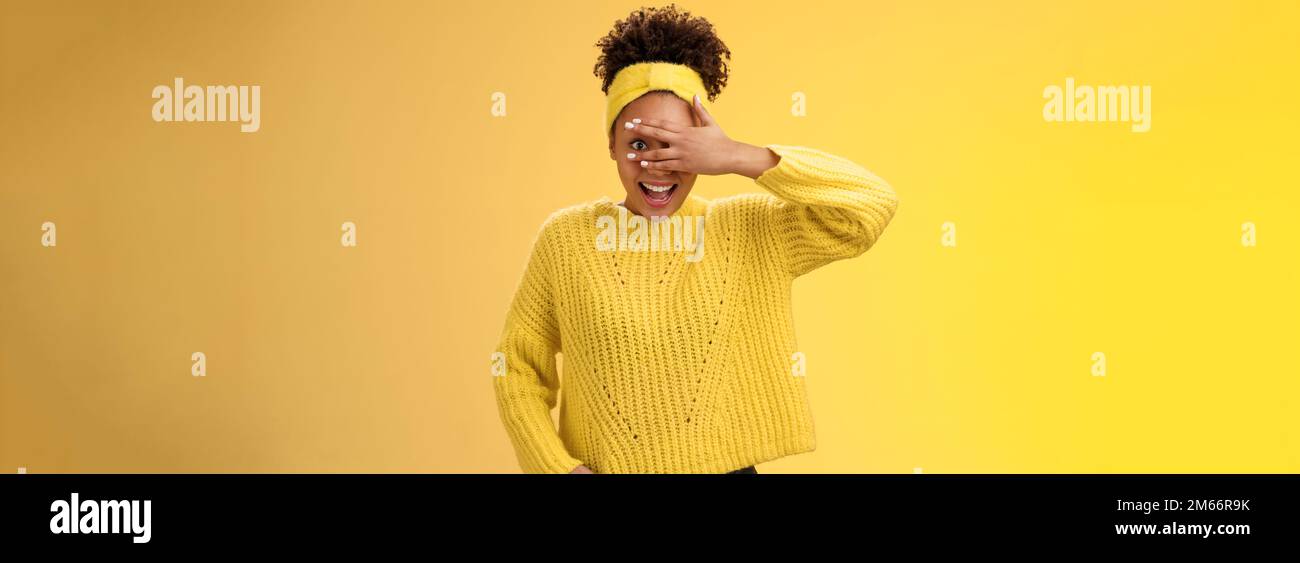 Charming passionate happy smiling african-american millennial girl hide ...