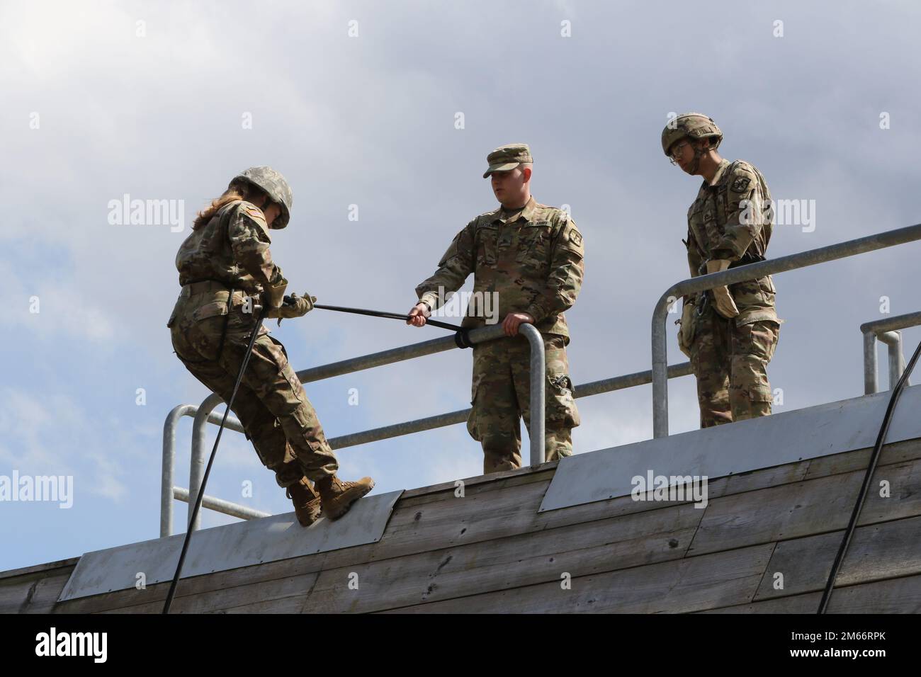 U.S. Army ROTC Cadet Elizabeth Ann Burke begins to rappel down a tower ...
