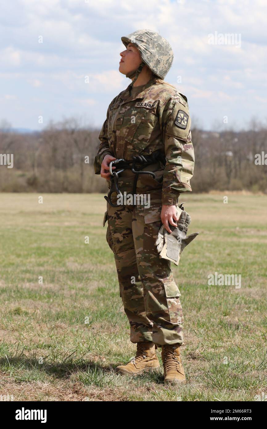 U.S. Army ROTC Cadet Elizabeth Ann Burke begins to rappel down a tower ...