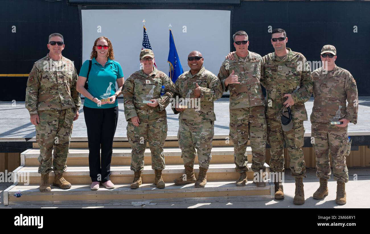 Winners of the quarterly awards ceremony stand with Col. Matthew ...
