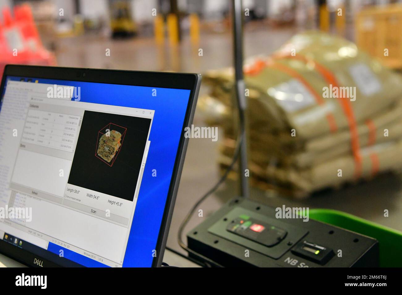 The Configured Air Load Building Tool scans cargo at the 436th Aerial ...