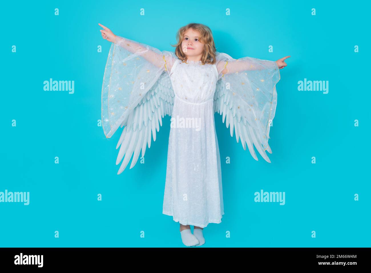 Cute angel kid, studio portrait. Blonde curly little angel child with ...
