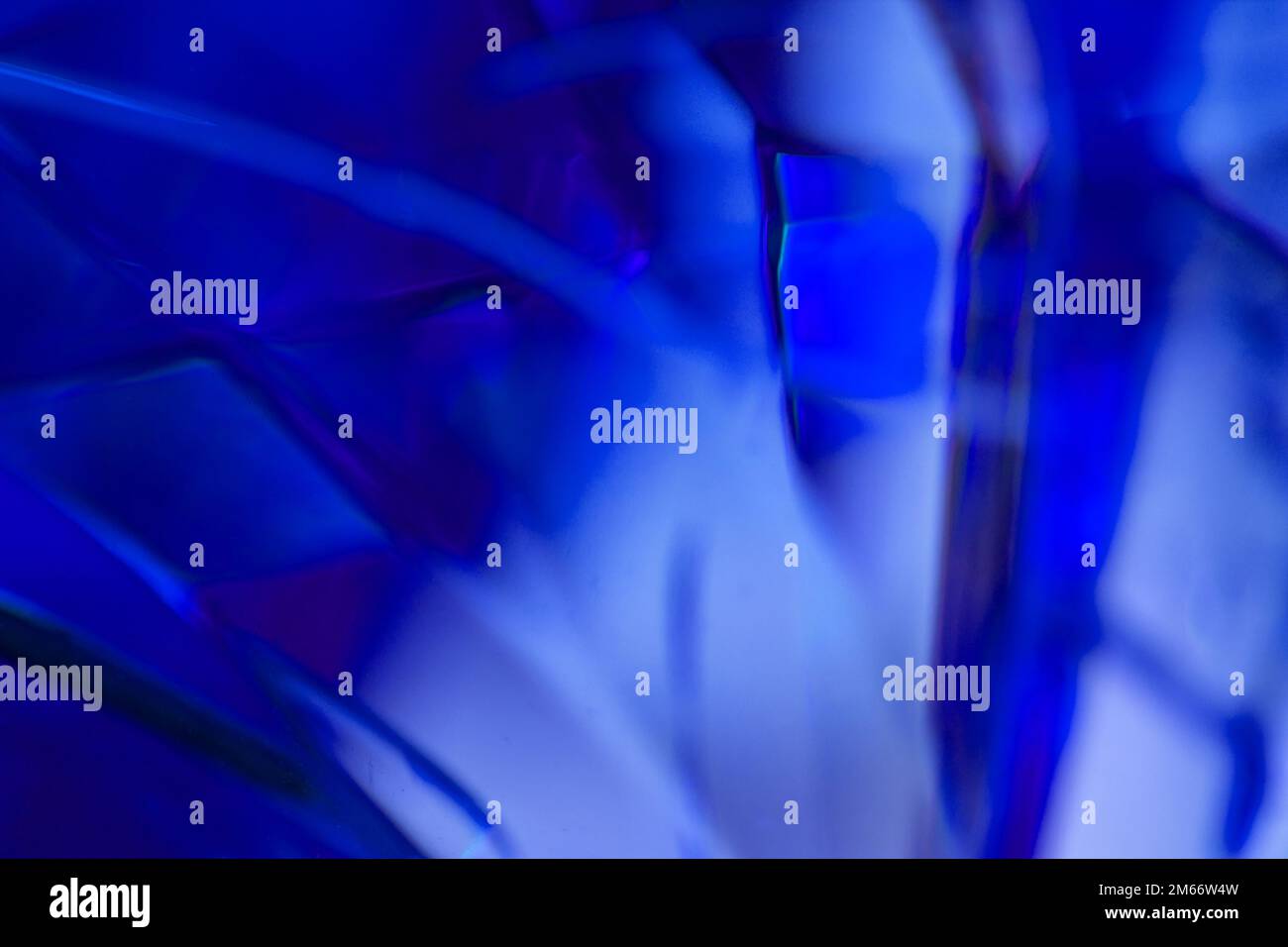 Blue, shiny, and abstract glass captured in a blurry photo with a ...