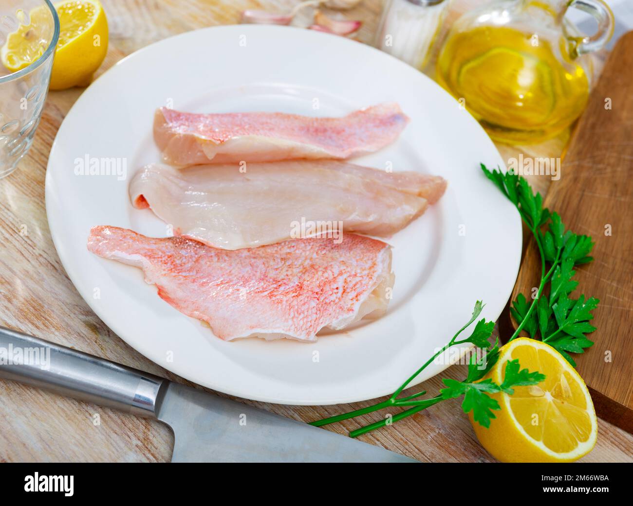 Fresh raw fillet of sea bass Stock Photo - Alamy